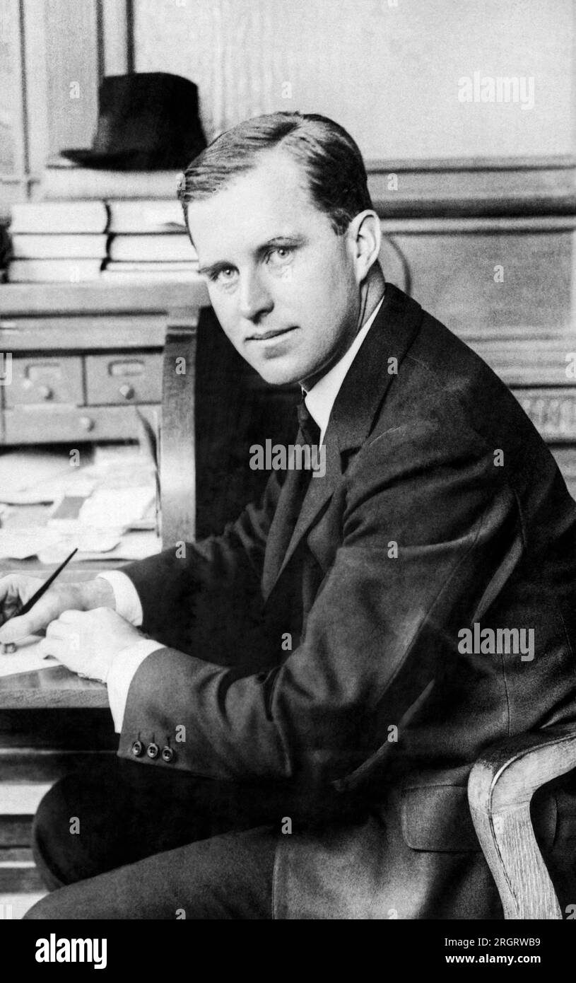 United States: c. 1920 A portrait of Joseph Kennedy working at his desk ...