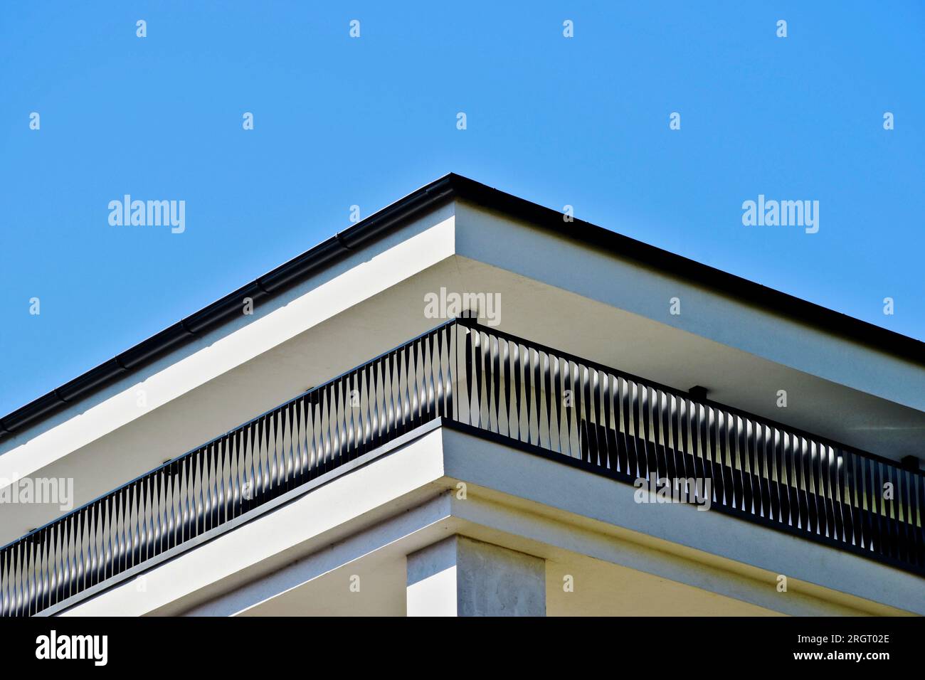 modern steel picket terrace balustrade closeup. white stucco exterior ...