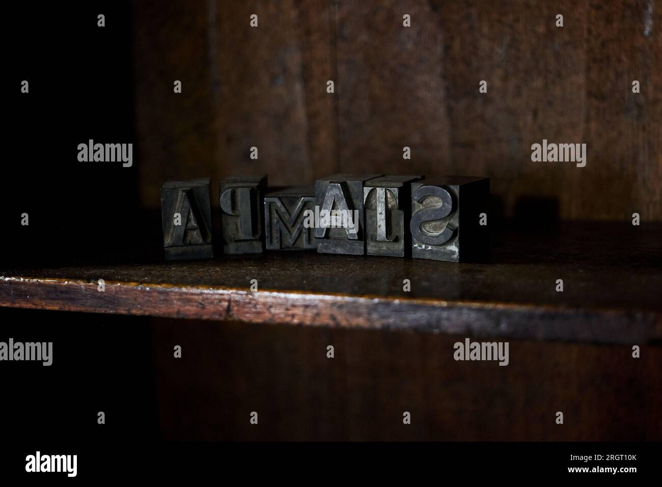 old typeface stamps tools with the inscription print Stock Photo - Alamy