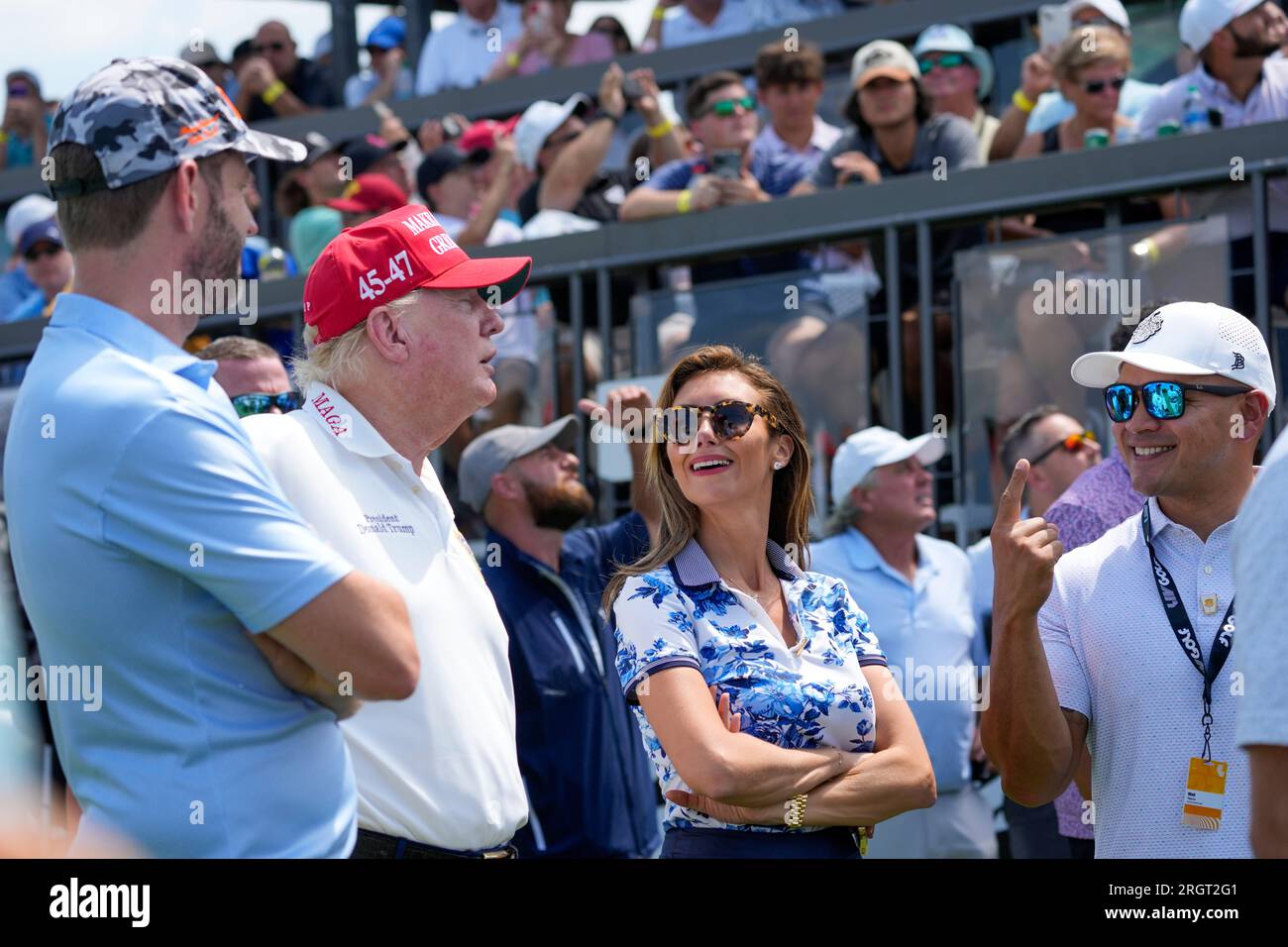 Eric Trump, left, former President Donald Trump, center, Alina Habba ...