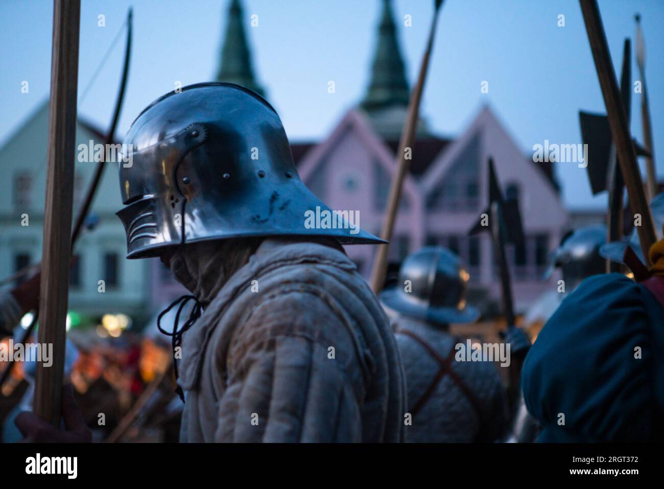 Medieval knights in metal armour and helmet wuth a spear during ...
