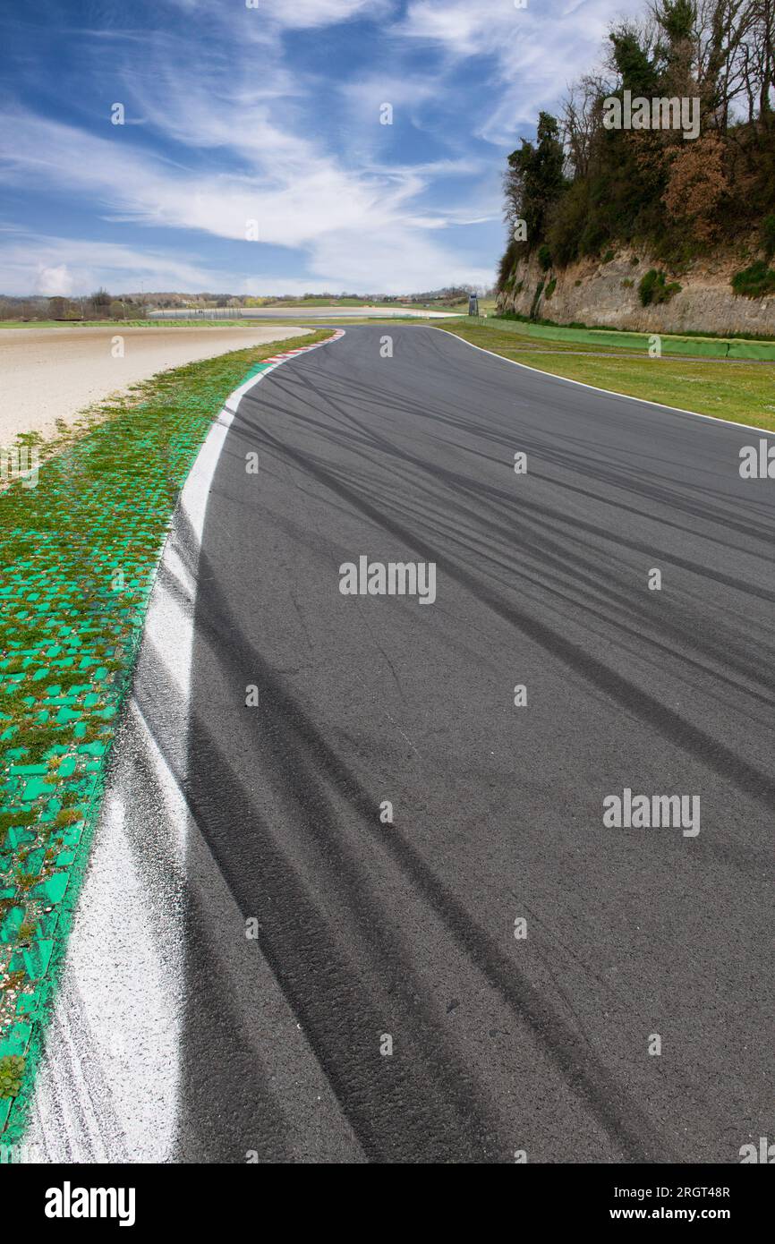 Road asphalt track with skid marks, low angle view of motor sport ...