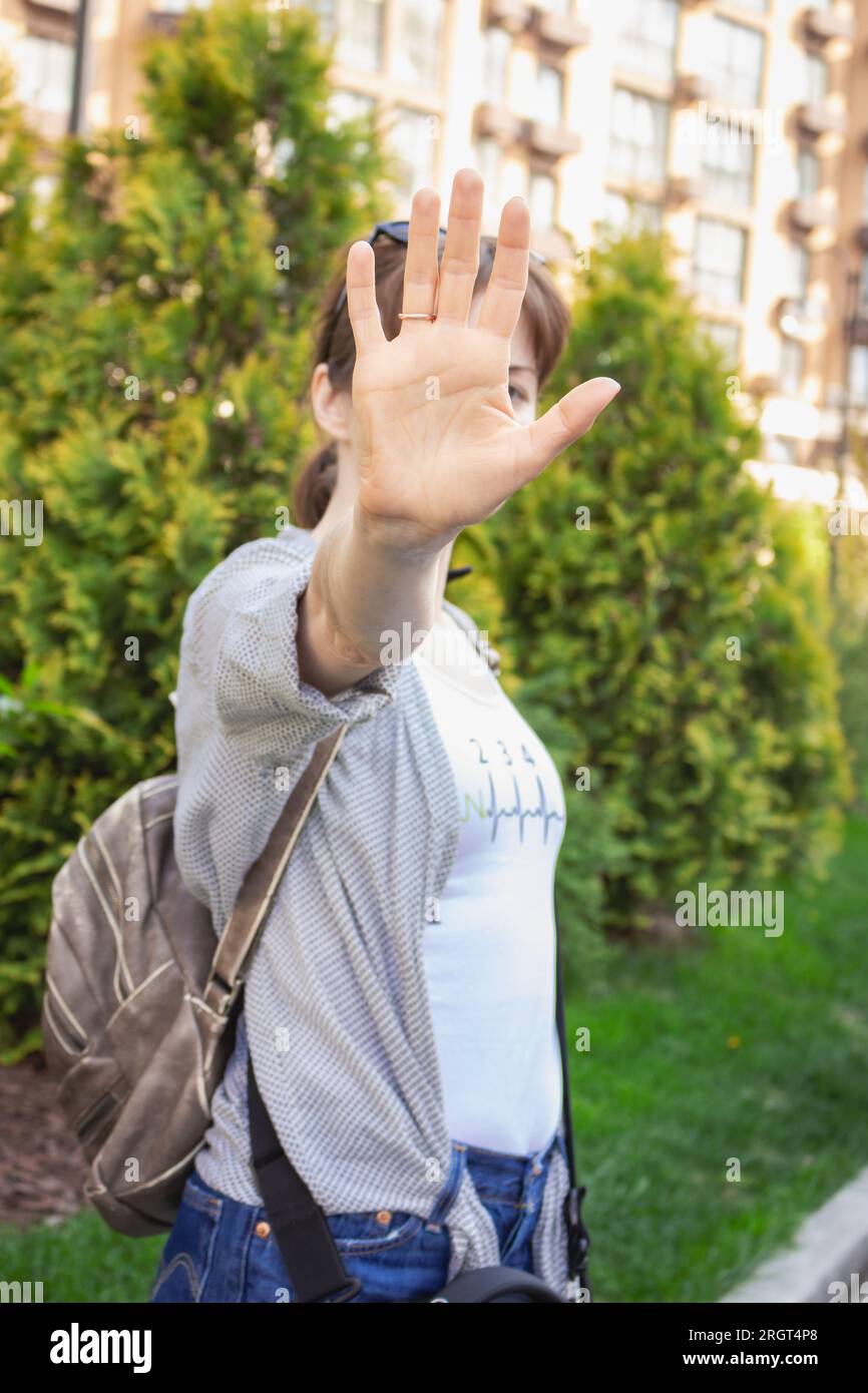 Woman showing gesture stop. Warning gesture. Domestic abuse concept ...