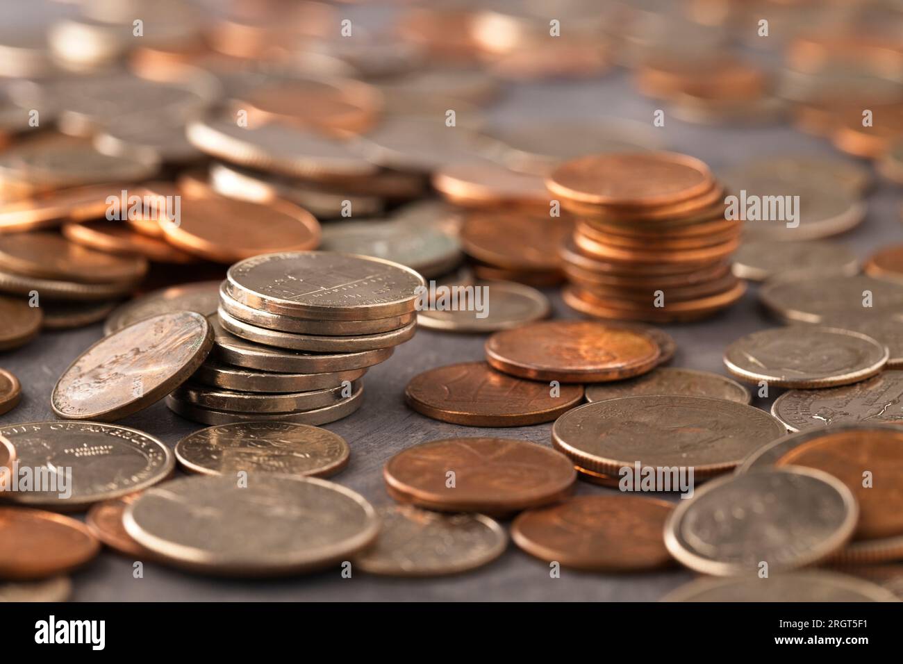 A concept close up photo of various US coins bunched together in a ...