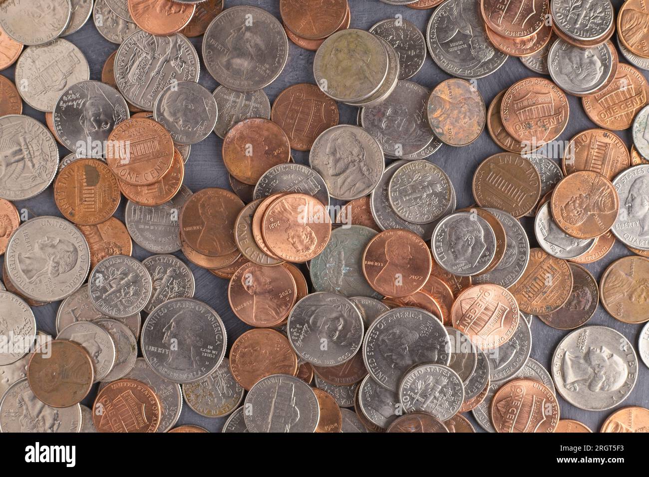 A concept close up flatlay photo of various US coins bunched together ...