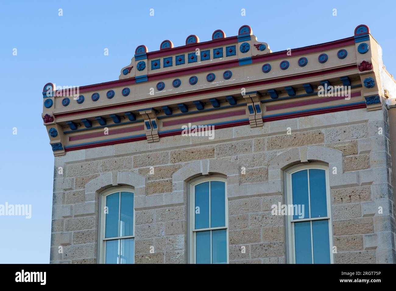 Ornate cornice adorns classic 1875 limestone block storefront in ...
