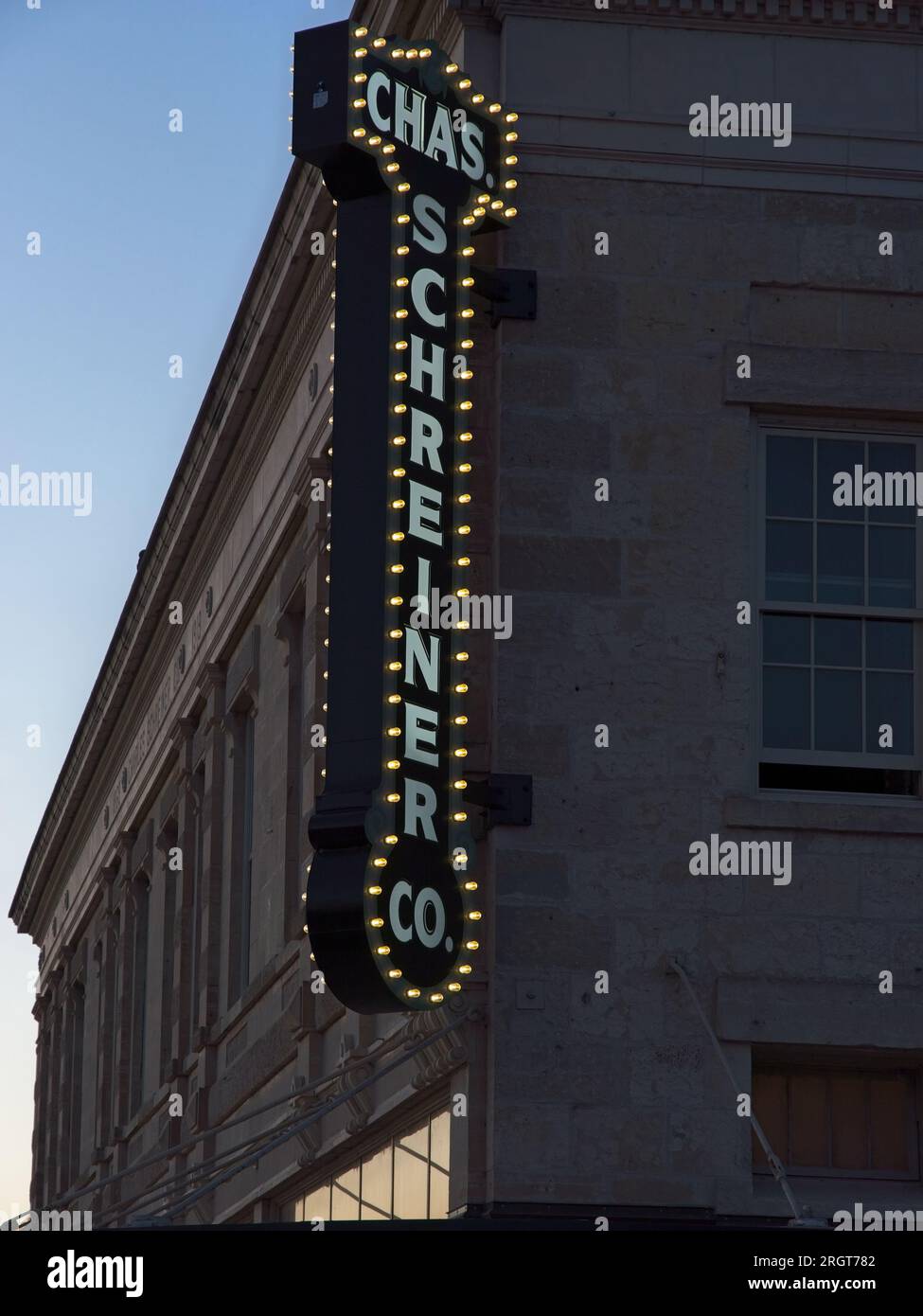 Illuminated Schreiner department store sign on corner of circa 1919 ...