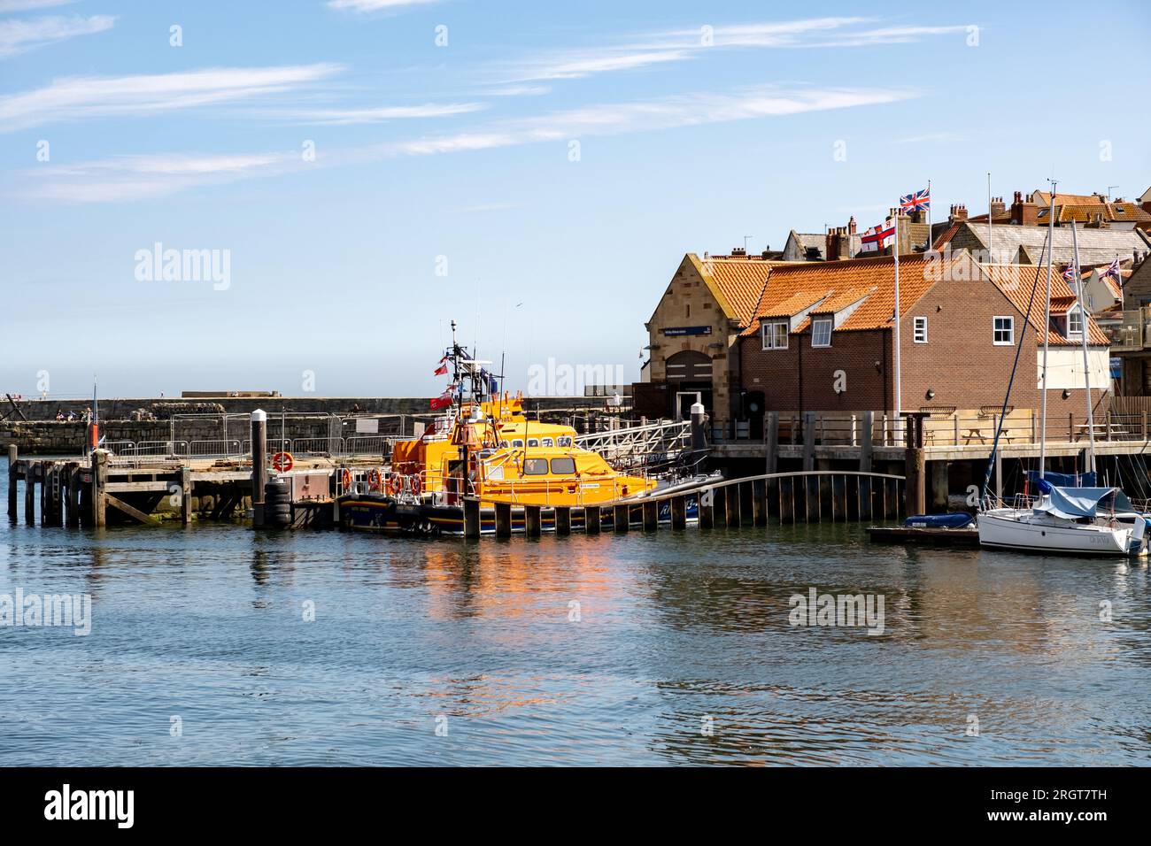 Whitby lifeboat moored outside the RNLI lifeboat shed in Whitby marina ...