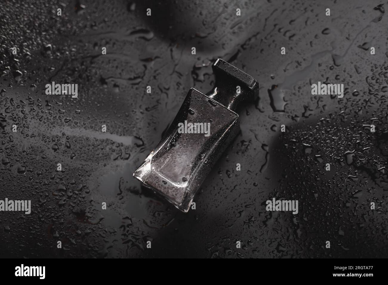 female wet perfume on grey table Stock Photo - Alamy