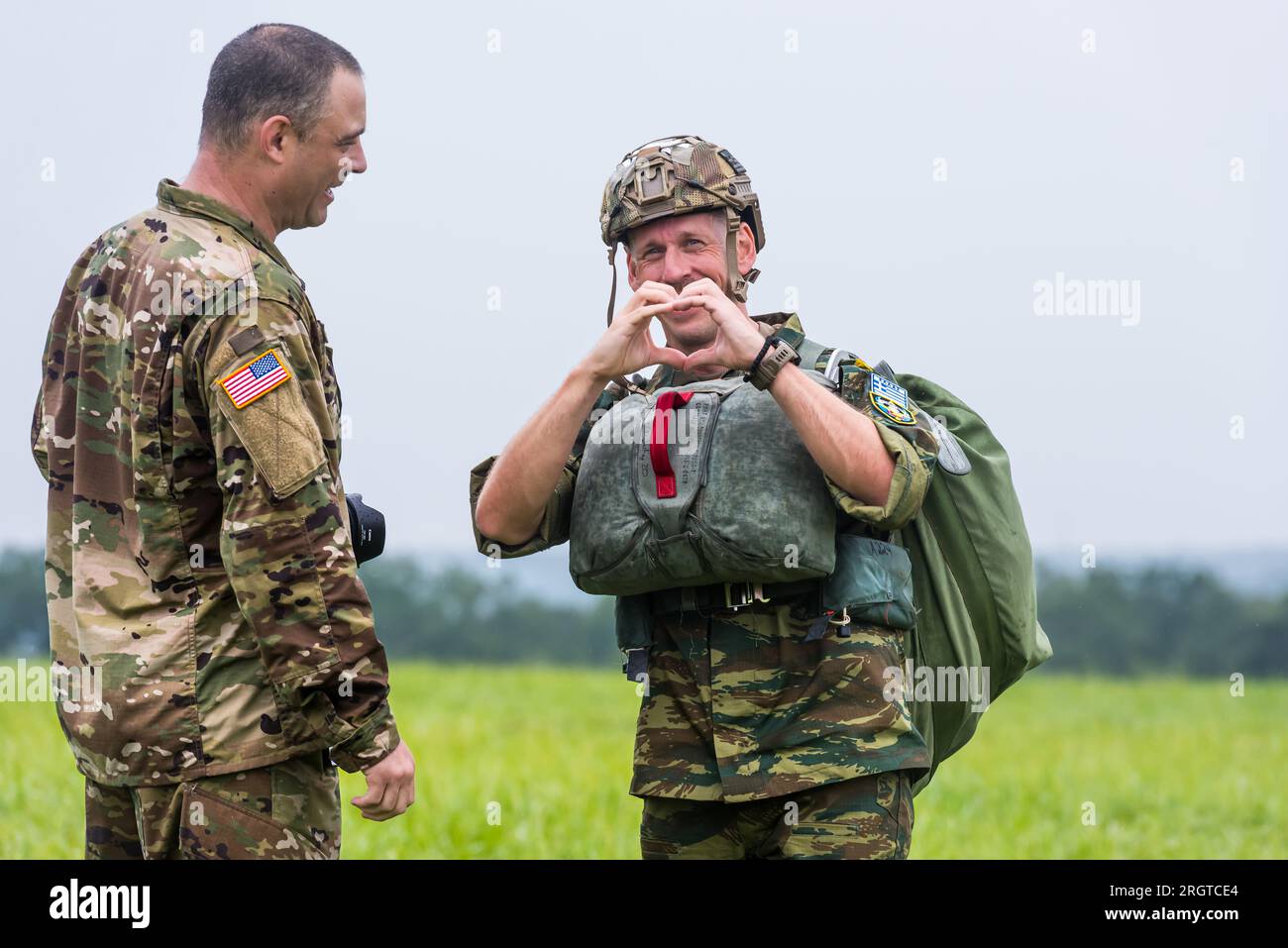 Greek paratrooper making heart sign with both hands at Leapfest, an ...