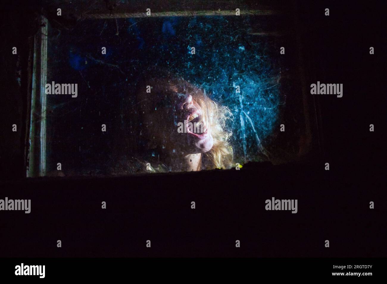 scary woman behind window at night Halloween horror background Stock ...