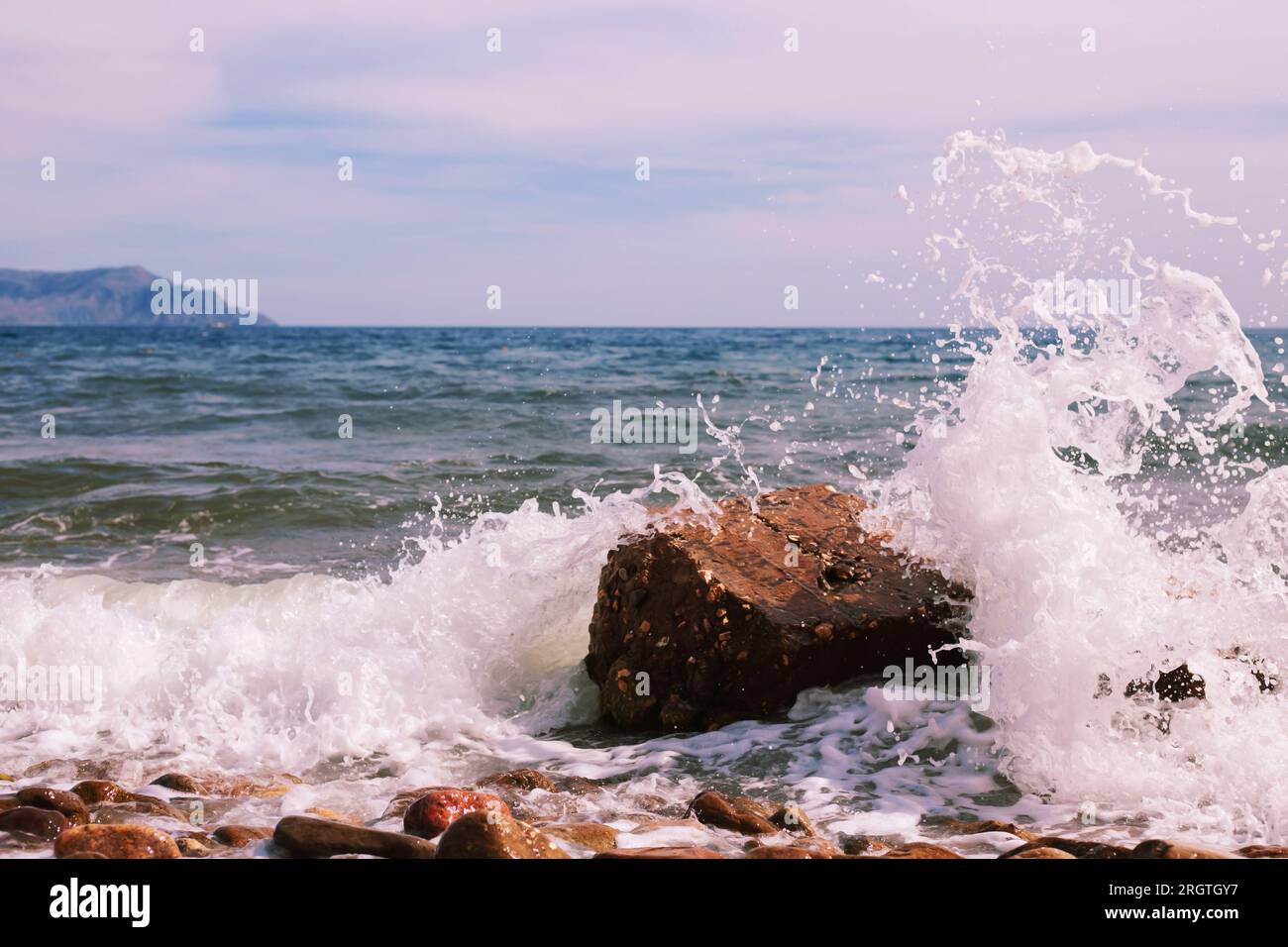 Powerful Waves crushing on a rocky beach Stock Photo - Alamy