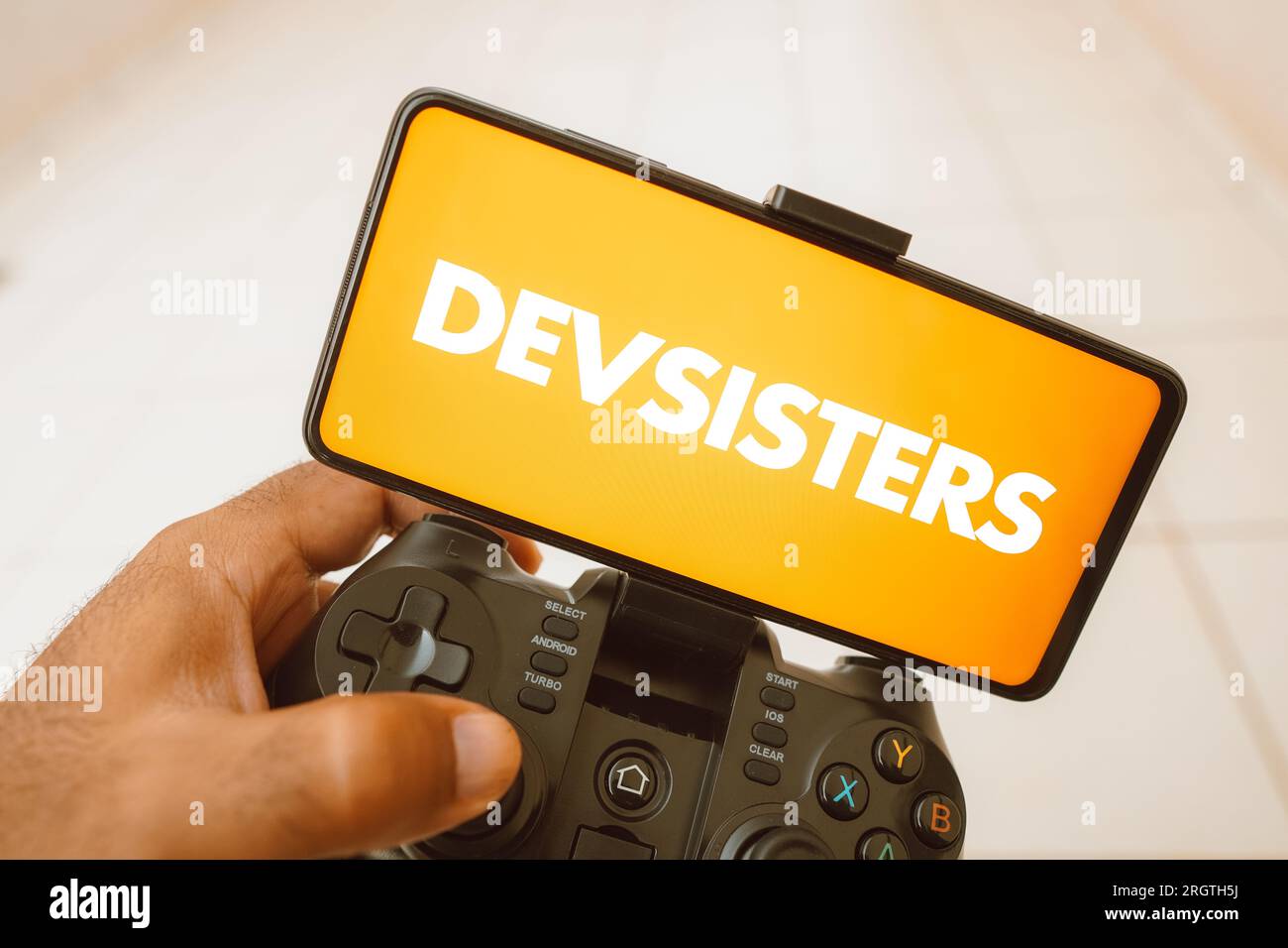 In this photo illustration, a person plays on a joystick and the ...