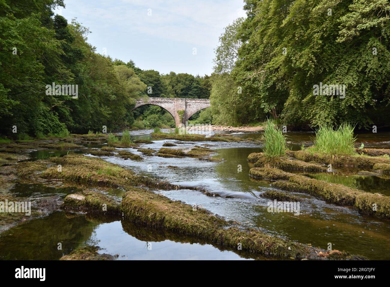Exposed rocks with the River South Esk in low summer flow at the ...