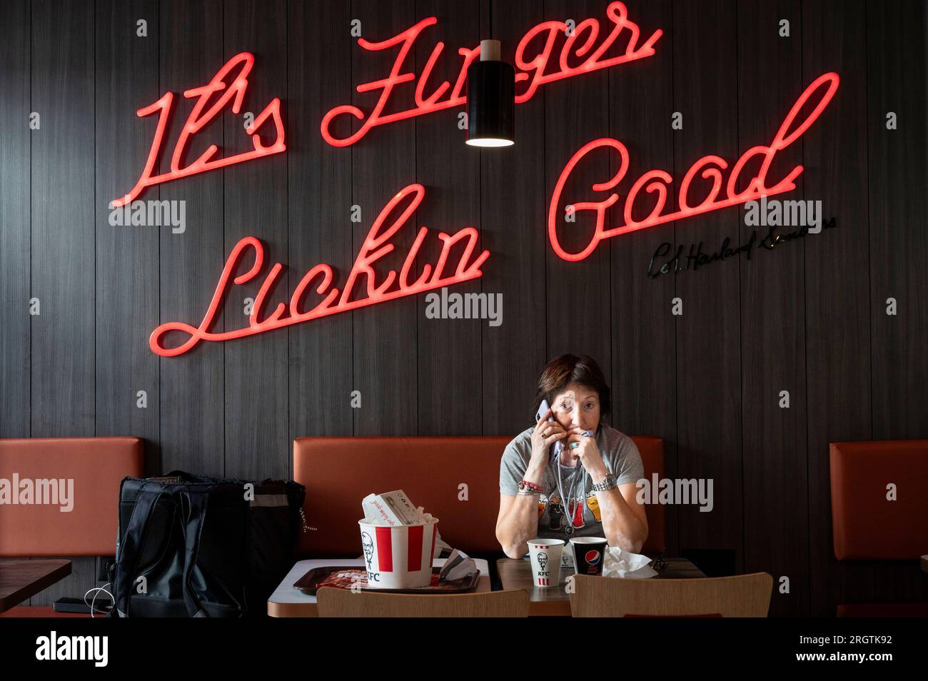A customer is seen eating at the American fast food chicken restaurant ...