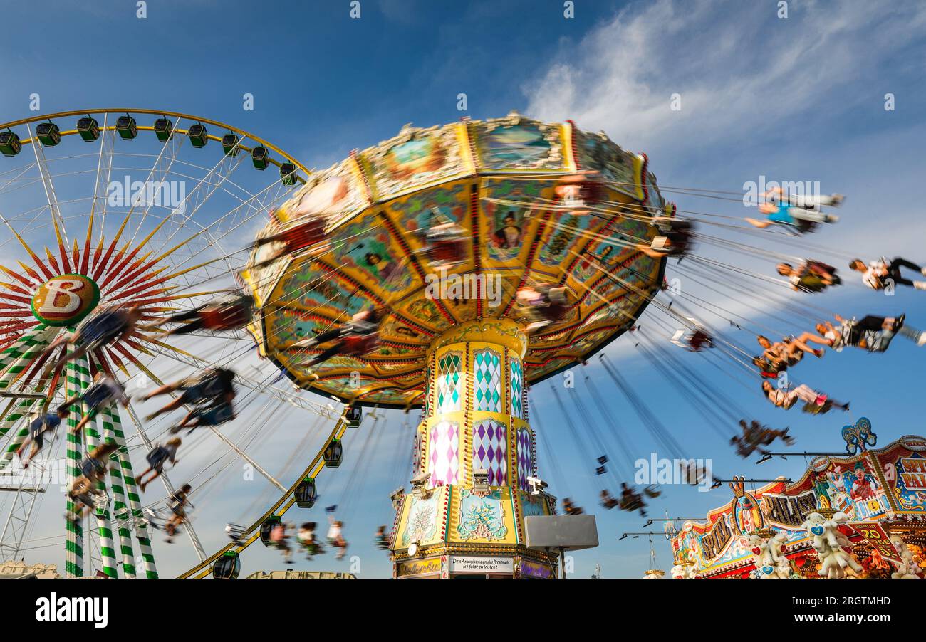 Herne, Germany. 11th Aug, 2023. A traditional swing ride merry-go-round ...