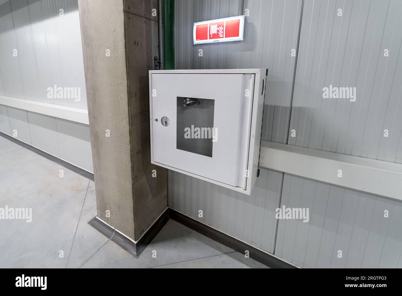 Fire hydrant cabinet in a new industrial building Stock Photo - Alamy