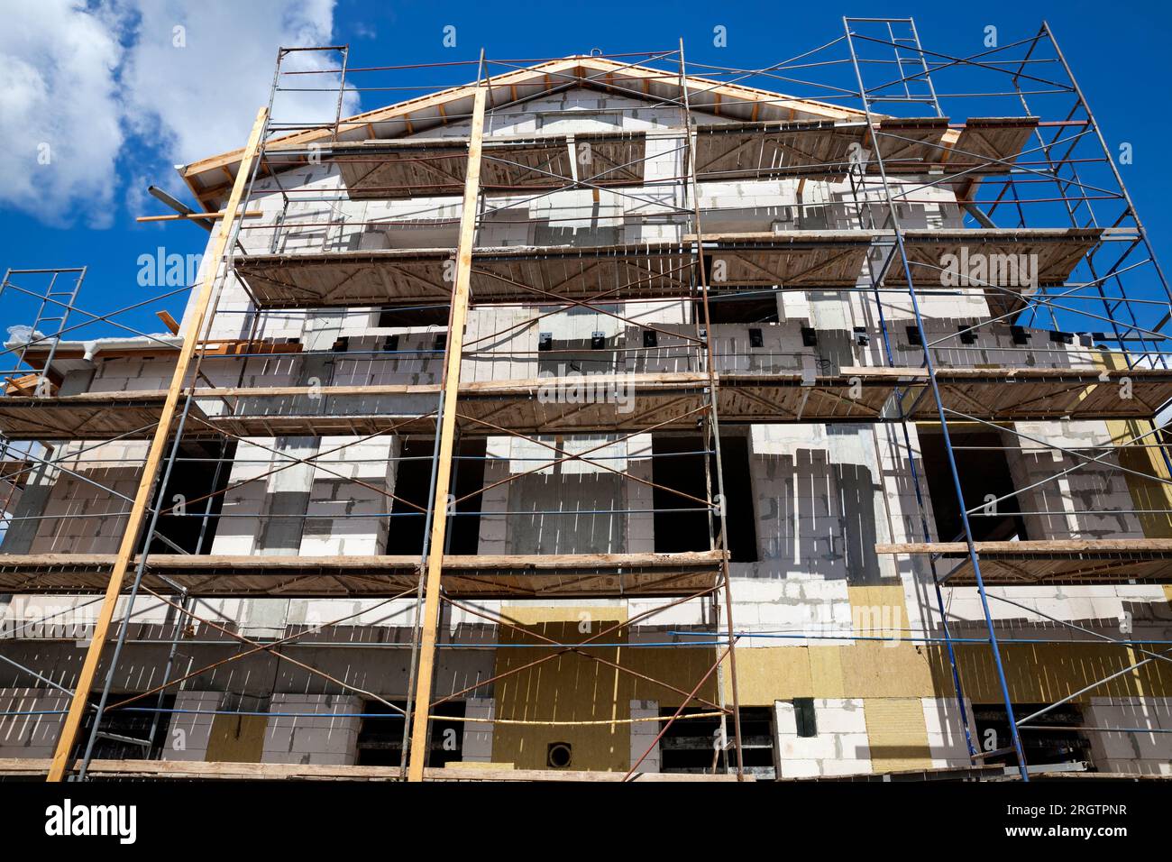 building a new home on the building scaffolding for construction and ...