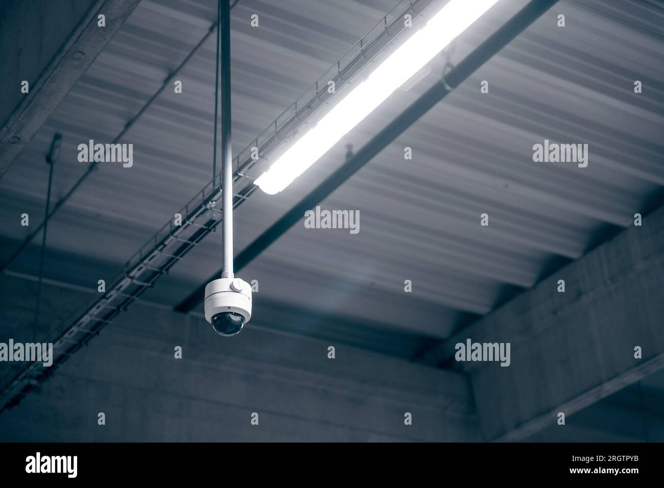 Digital surveillance camera on the ceiling in a warehouse room Stock ...