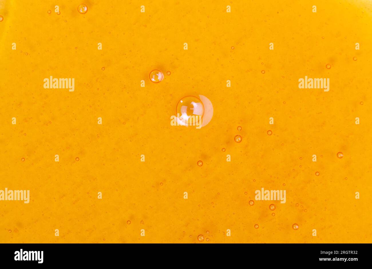 beautiful background of thick and sweet honey with air bubbles, close ...