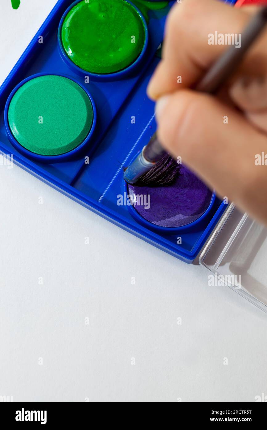 the creative process of drawing by mixing different colors of paints ...