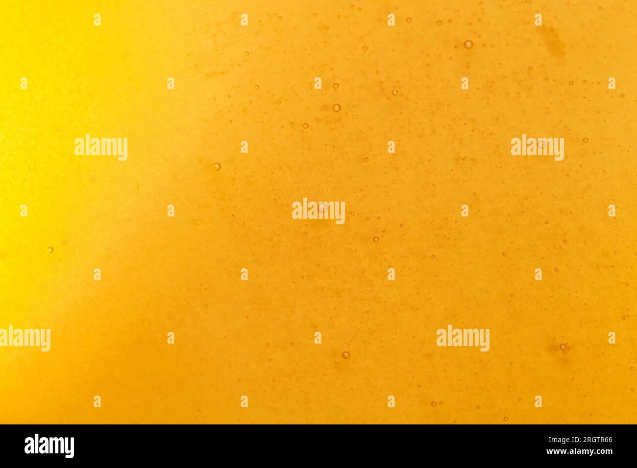 beautiful background of thick and sweet honey with air bubbles, close ...