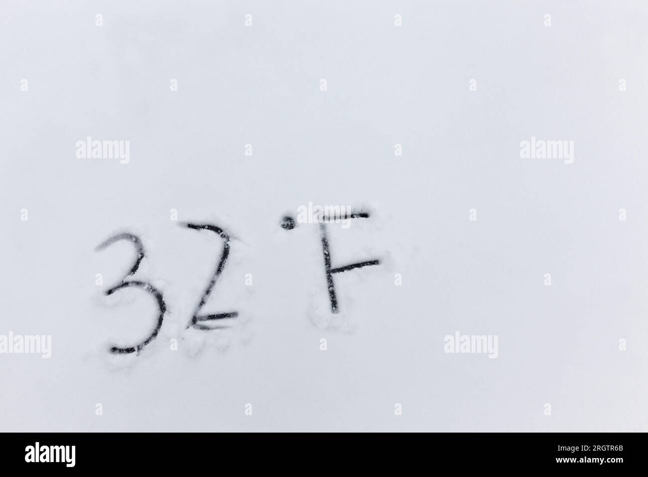 drawn on the snow, temperature symbols denoting negative very cold ...