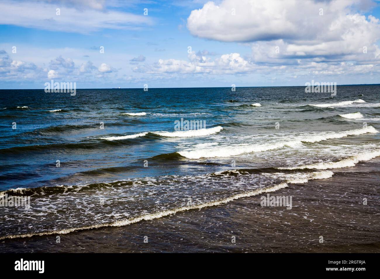 sea coast with lots of waves from windy weather, Baltic sea in summer ...