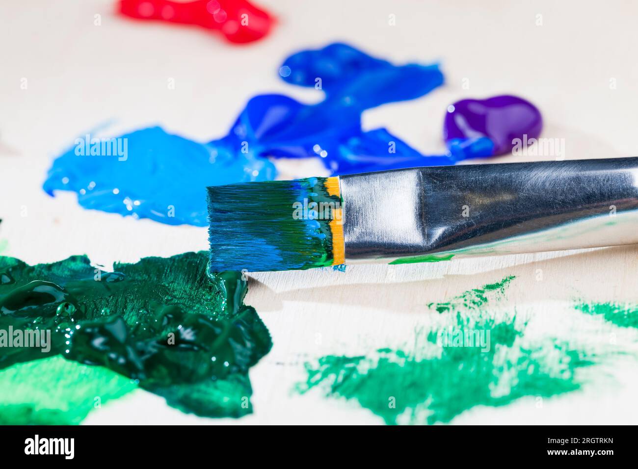 the creative process of drawing by mixing different colors of paints ...