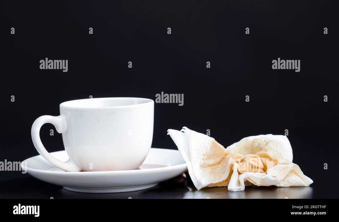 black aromatic coffee spilled due to carelessness, close up of glass ...