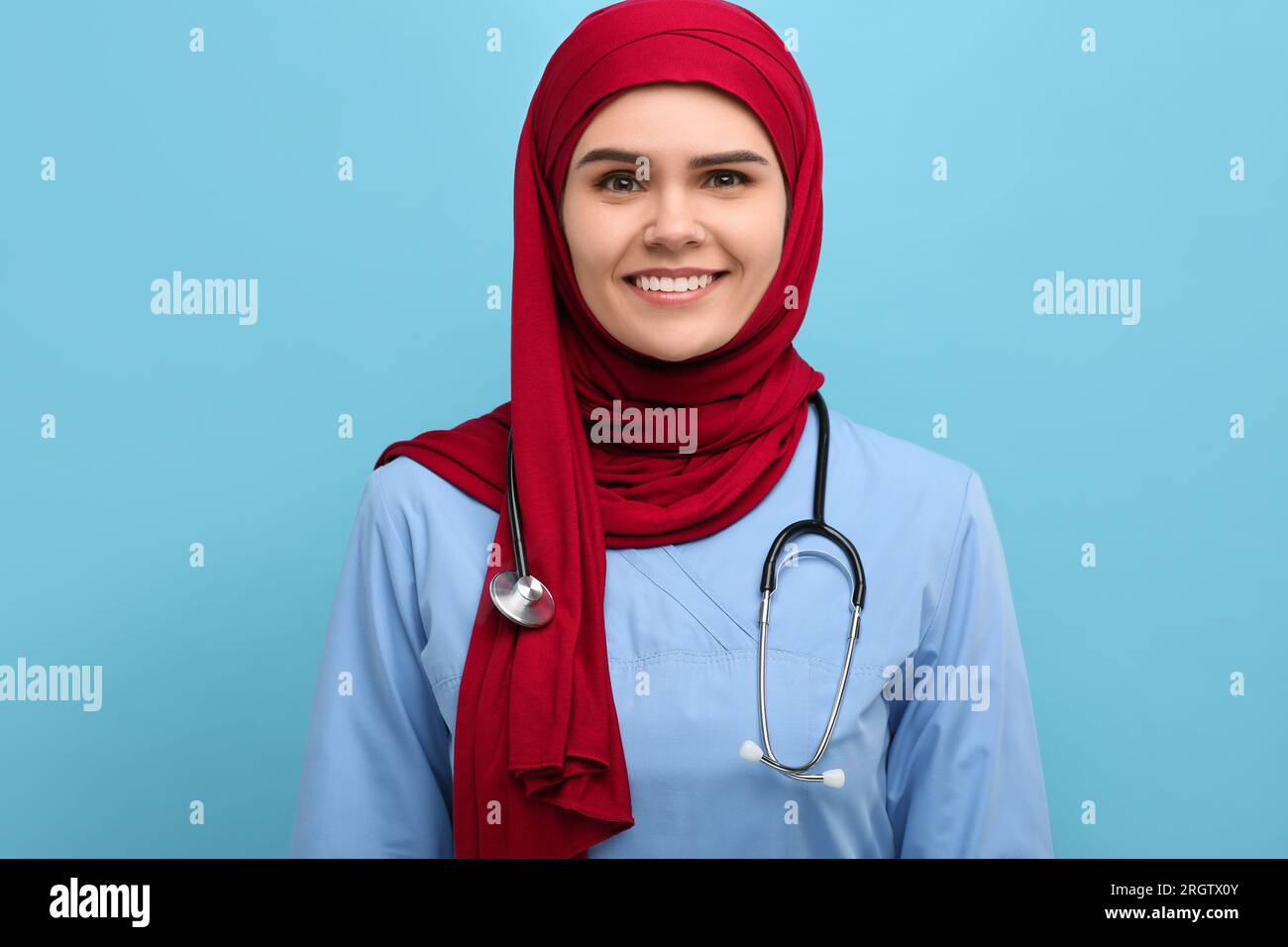 Muslim woman wearing hijab and medical uniform with stethoscope on ...