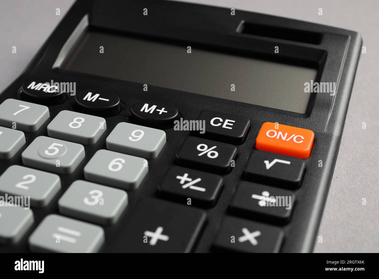 Calculator on grey background, closeup. Office stationery Stock Photo ...