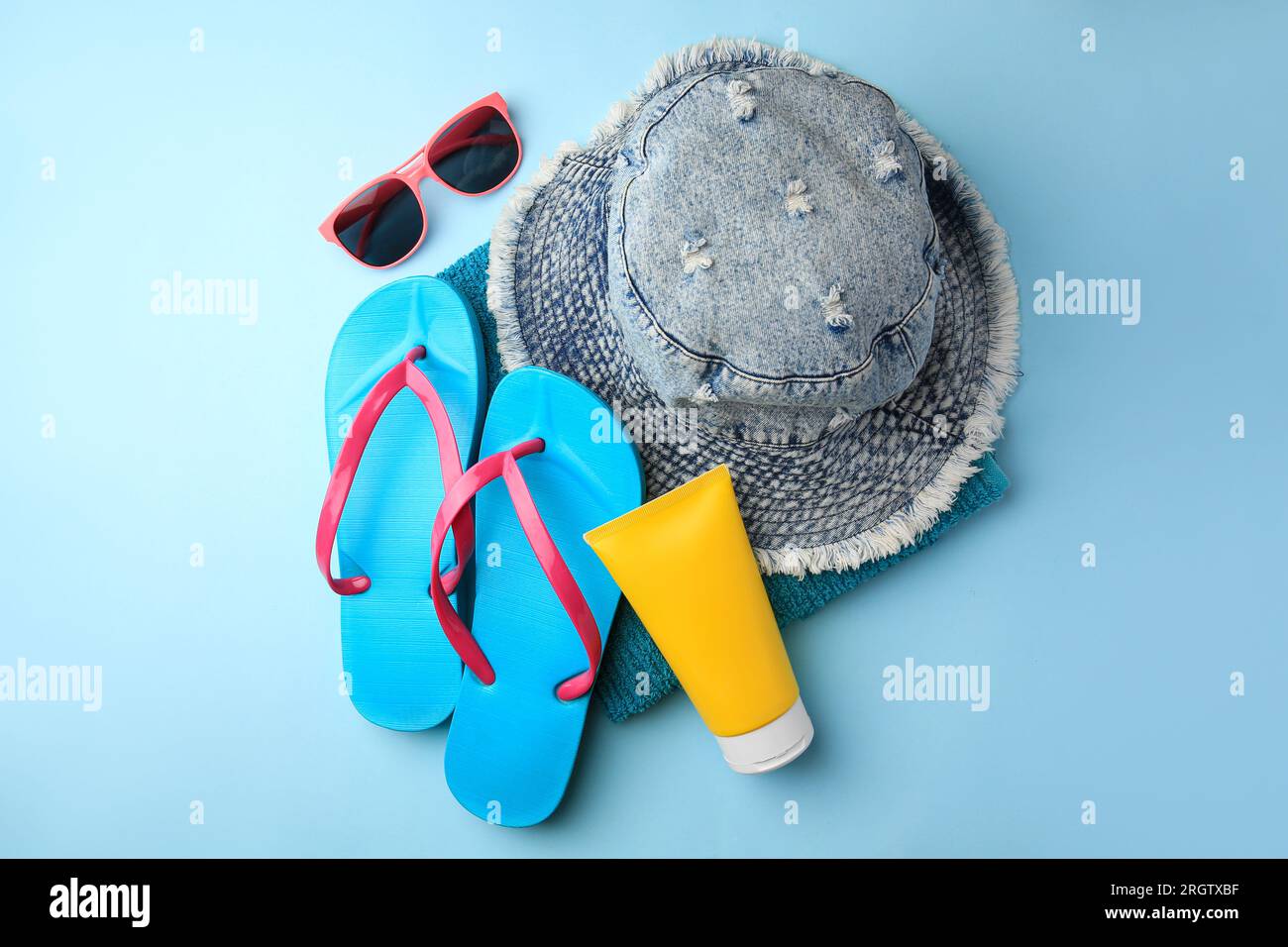 Flat lay composition with sunscreen and different beach accessories on ...
