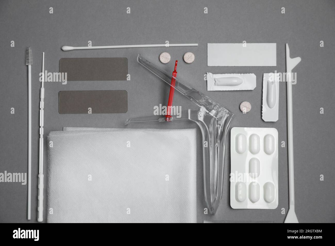 Sterile gynecological examination kit and medicaments on grey ...