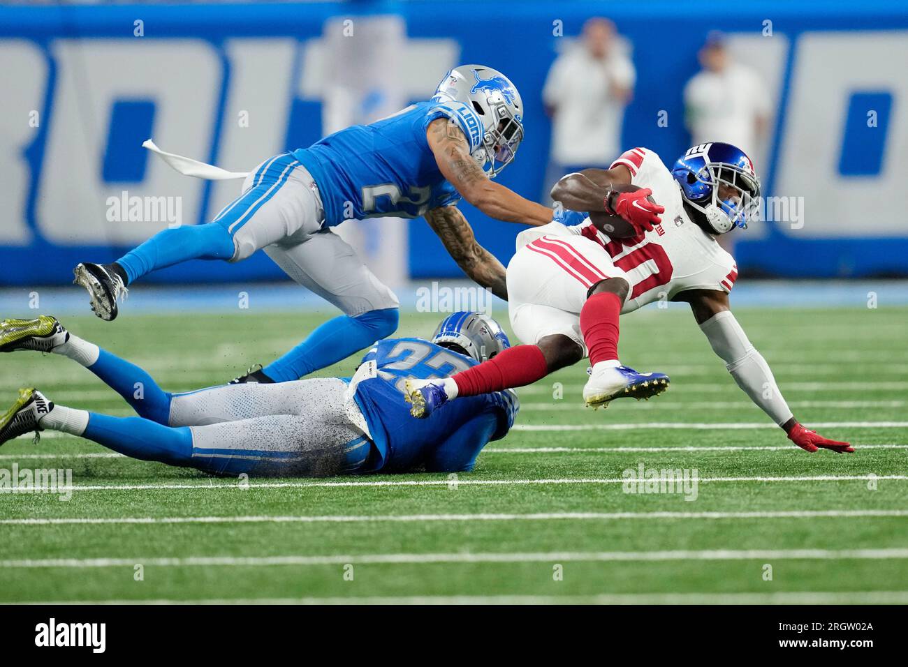 Detroit Lions cornerback Chase Lucas, top, and cornerback Saivion Smith ...