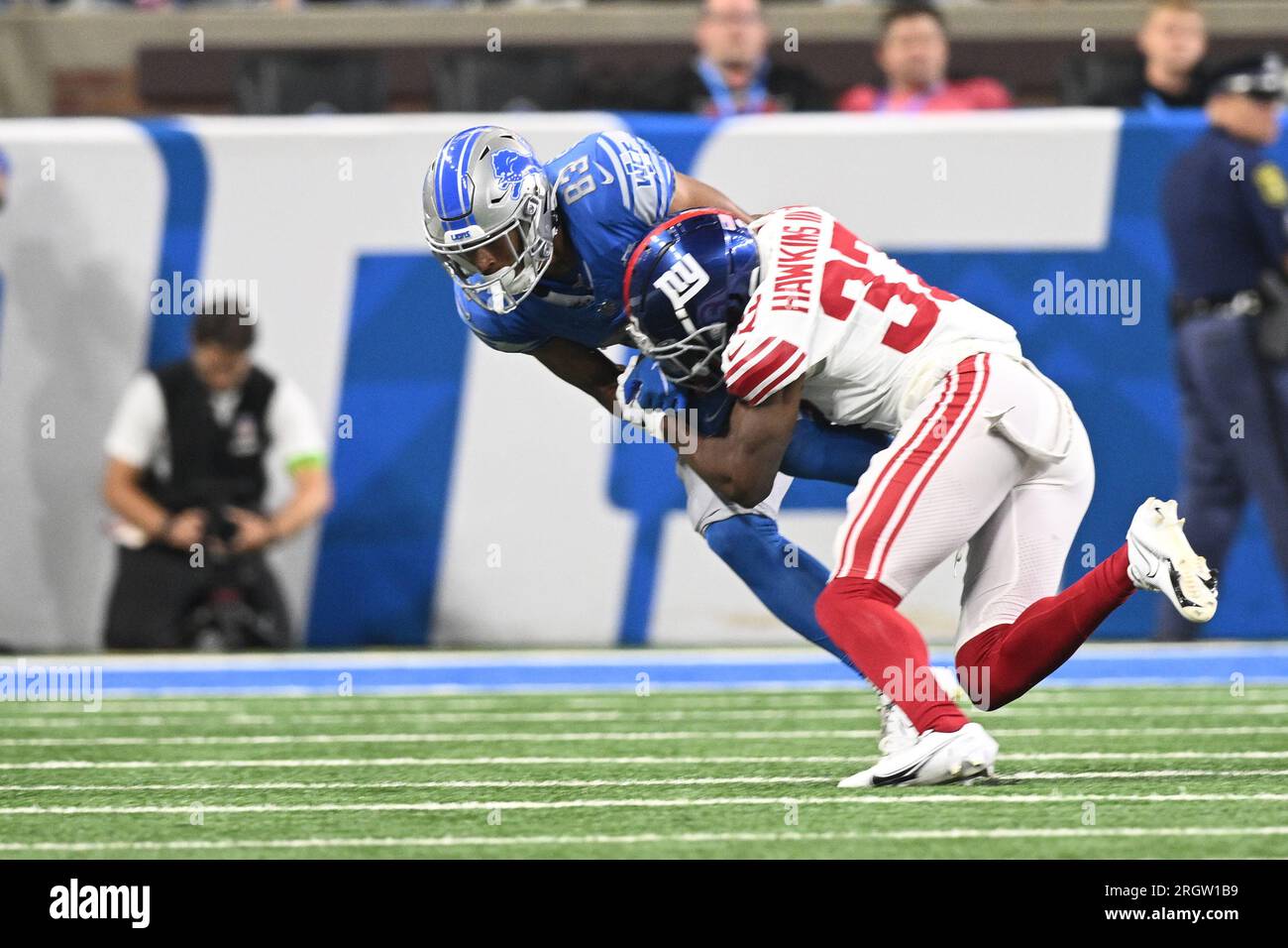 DETROIT, MI - AUGUST 11: New York Giants CB Tre Hawkins III (37) hits Detroit Lions WR Dylan ...