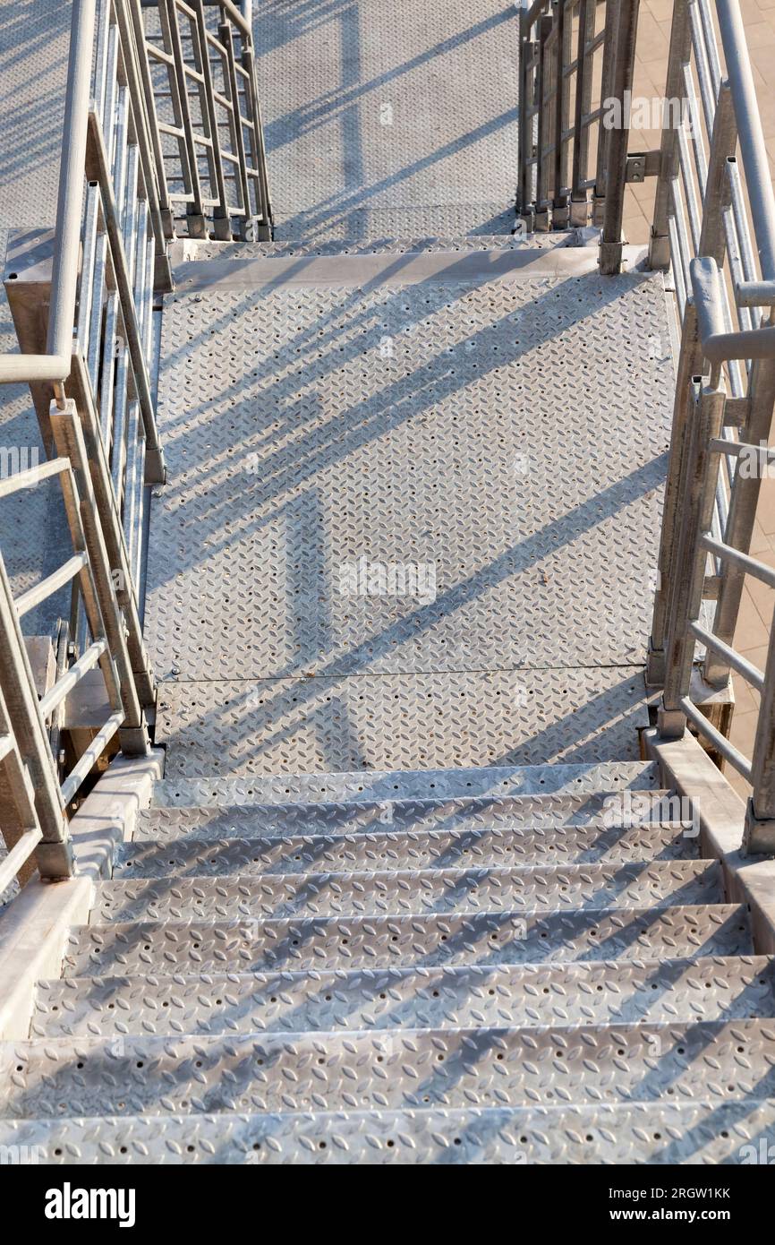 a metal ladder installed against the wall of the building to move ...