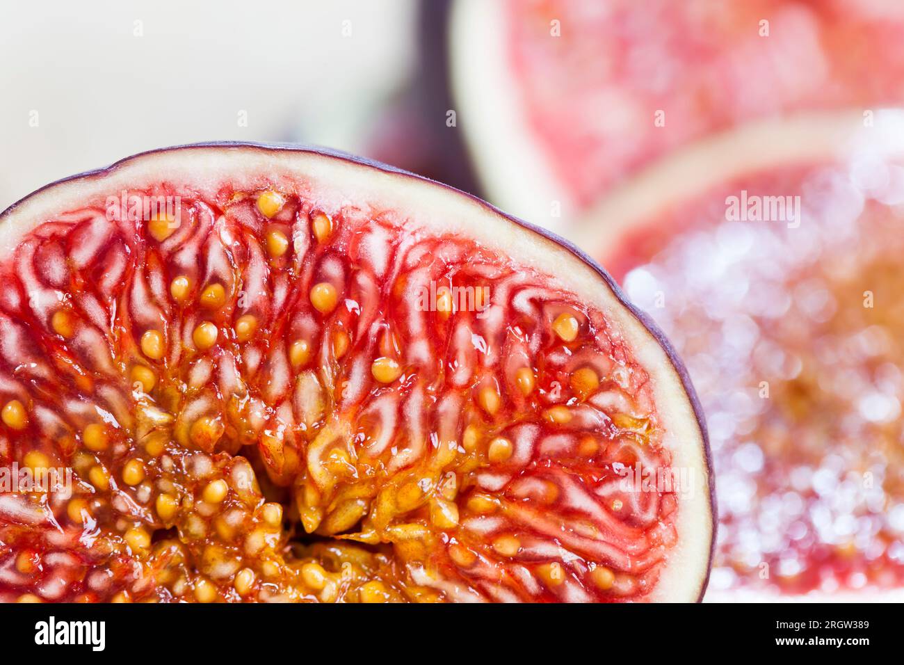 red delicious Fig pulp with seeds, ripe figs cut into several parts ...
