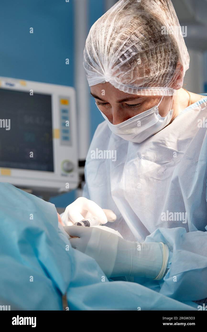 Close up of the face of a patient who is undergoing blepharoplasty. The ...