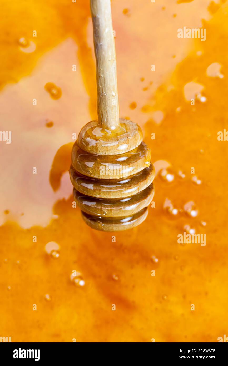 beautiful background of thick and sweet honey with air bubbles, close ...