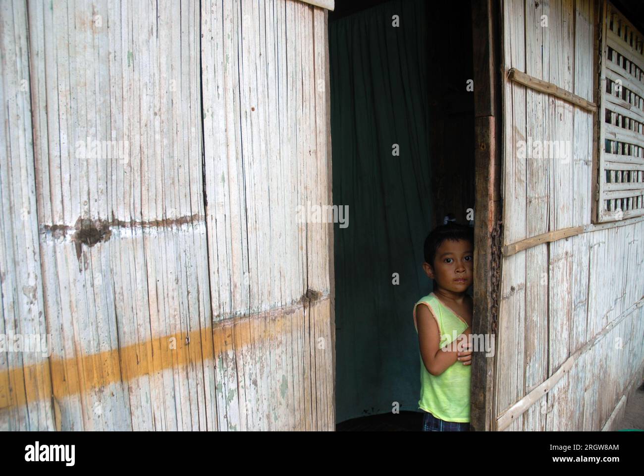 Children outside their home, Kannan, Samal, Davao del Norte ...