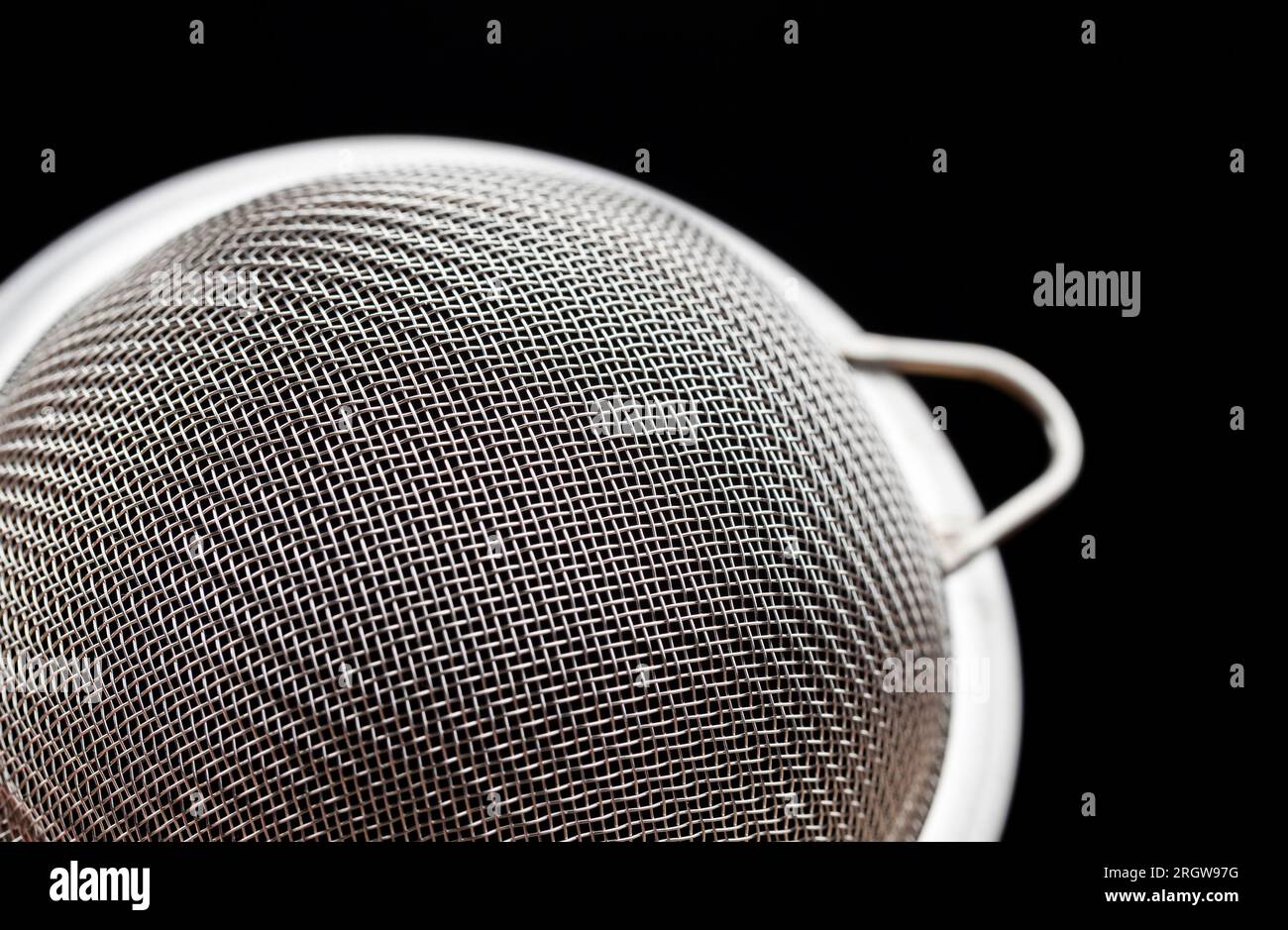 metal sieve with small cells for sifting flour and other bulk food ...