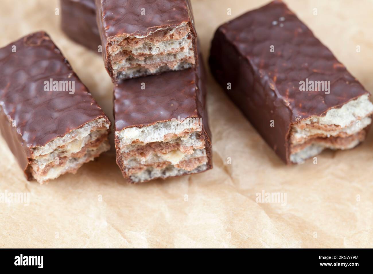 close up of chocolate candies and crispy flour waffles, milk chocolate ...