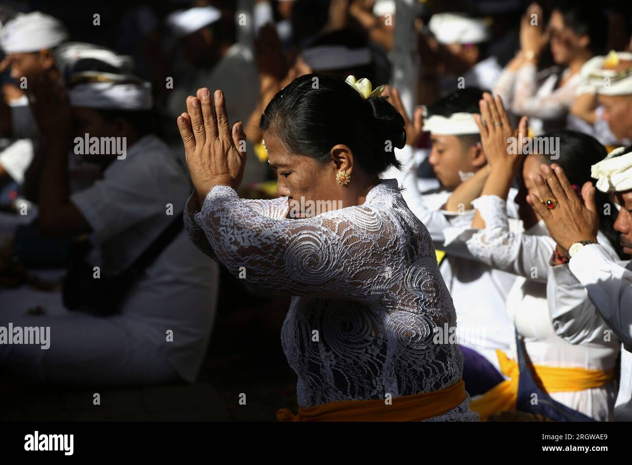 People celebrate during the Kuningan festival at a Hindu temple in ...