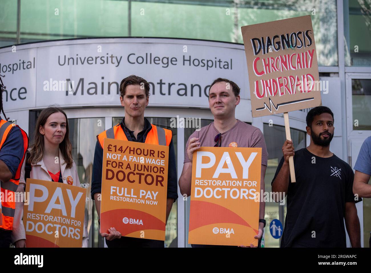 London, UK. 11th Aug, 2023. Protesters hold placards expressing their ...