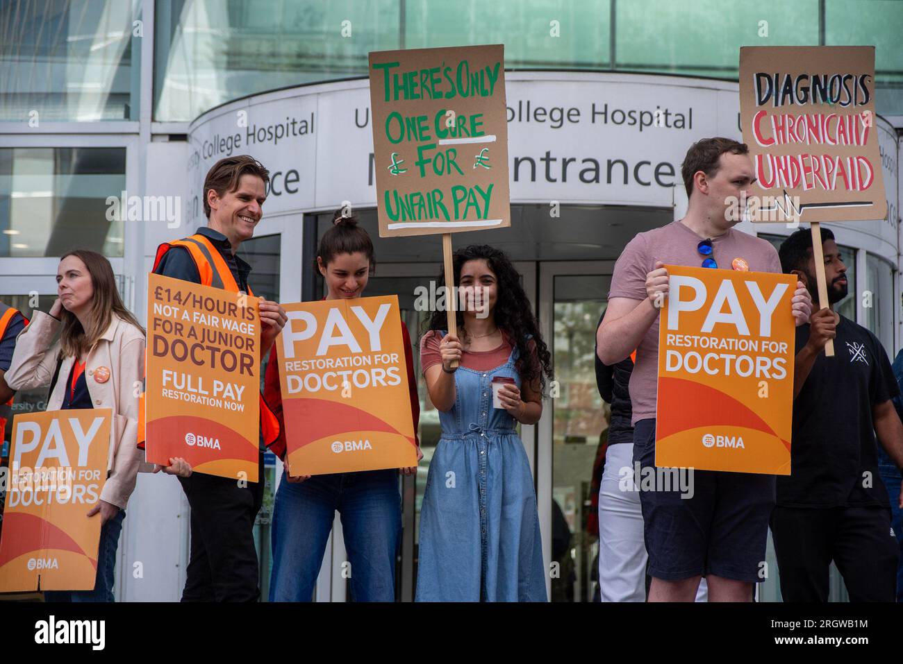 London, UK. 11th Aug, 2023. Protesters hold placards expressing their ...