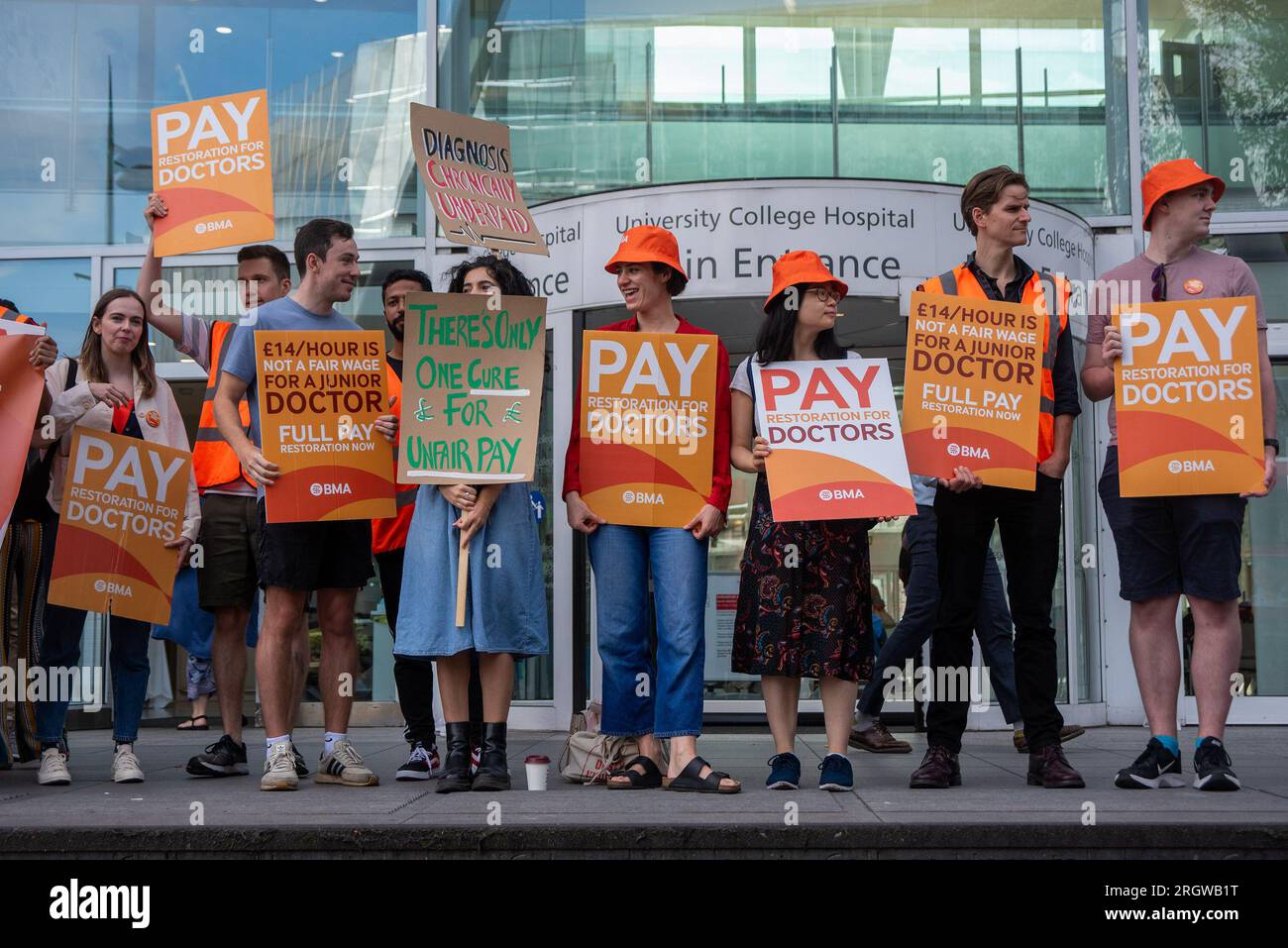 London, UK. 11th Aug, 2023. Protesters hold placards expressing their ...