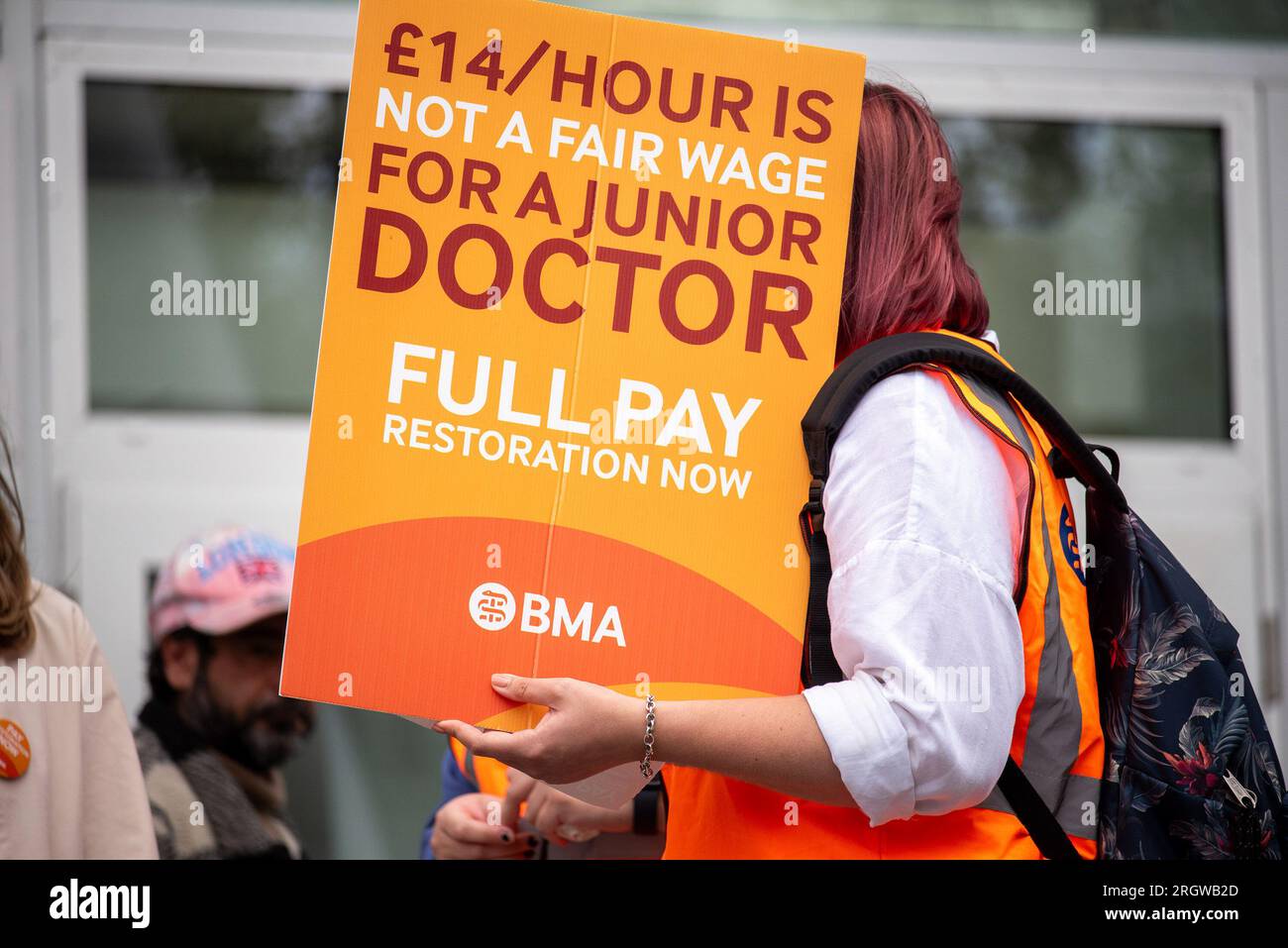 London, UK. 11th Aug, 2023. A protester holds a placard expressing her ...