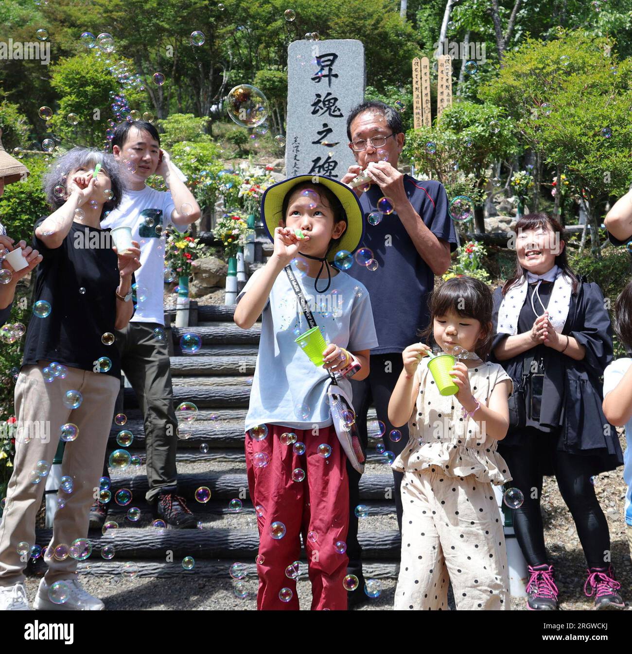 Bereaved family and others blow bubbles for the victims of the 1985 ...