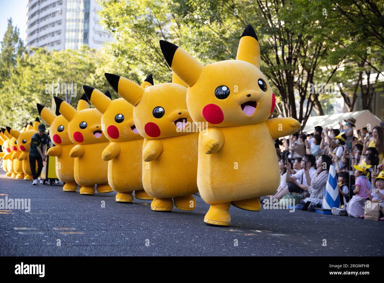 Yokohama, Japan. 11th Aug, 2023. Pikachus walk and dance in front of ...
